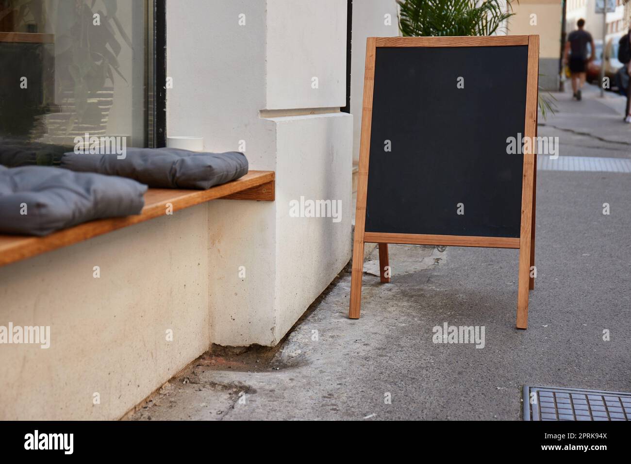Empty menuboard on in front of a restaurant, blank chalkboard, no text ...