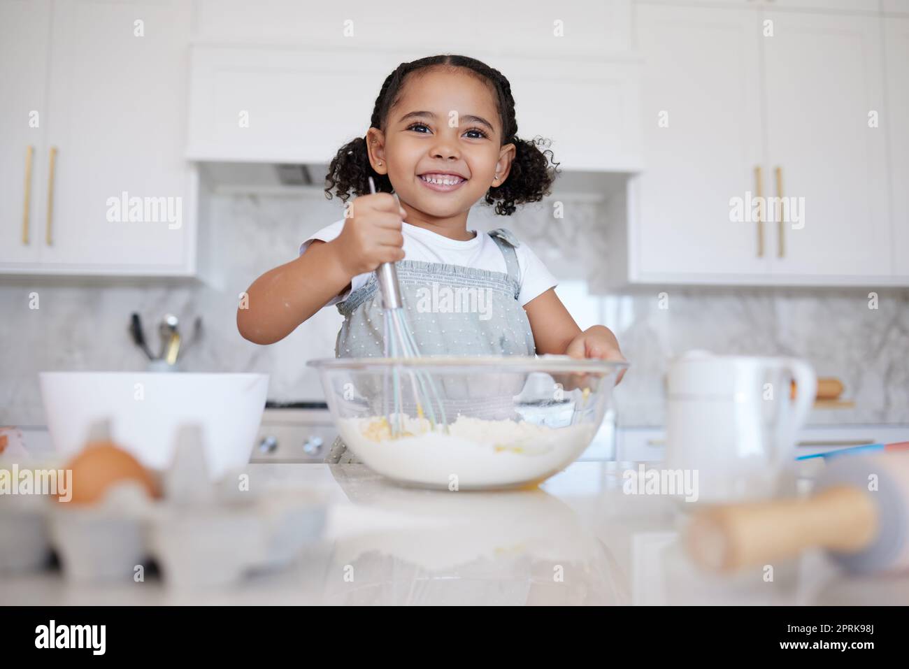 Happy girl kids baking in kitchen, house and home for childhood fun ...