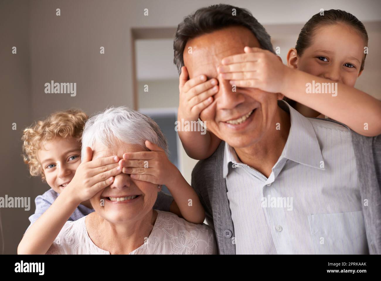 Smiling grandparents visiting family hi-res stock photography and ...