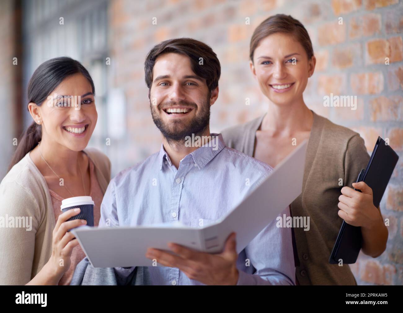 The number one team in the business. three young colleagues in their ...