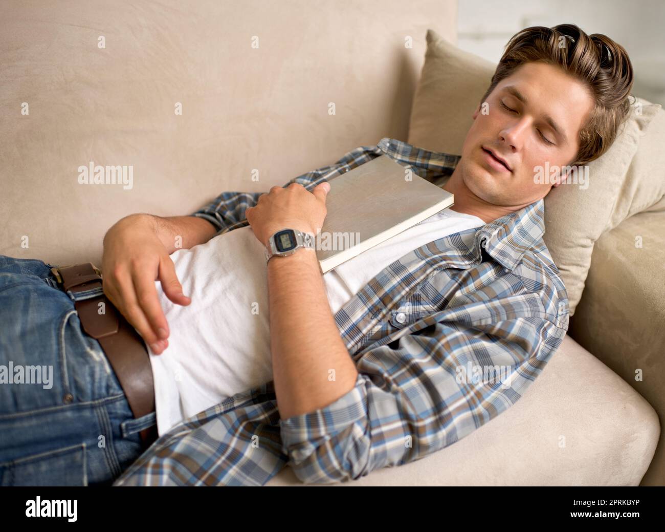 Man lounging on sofa lazy hi-res stock photography and images - Alamy