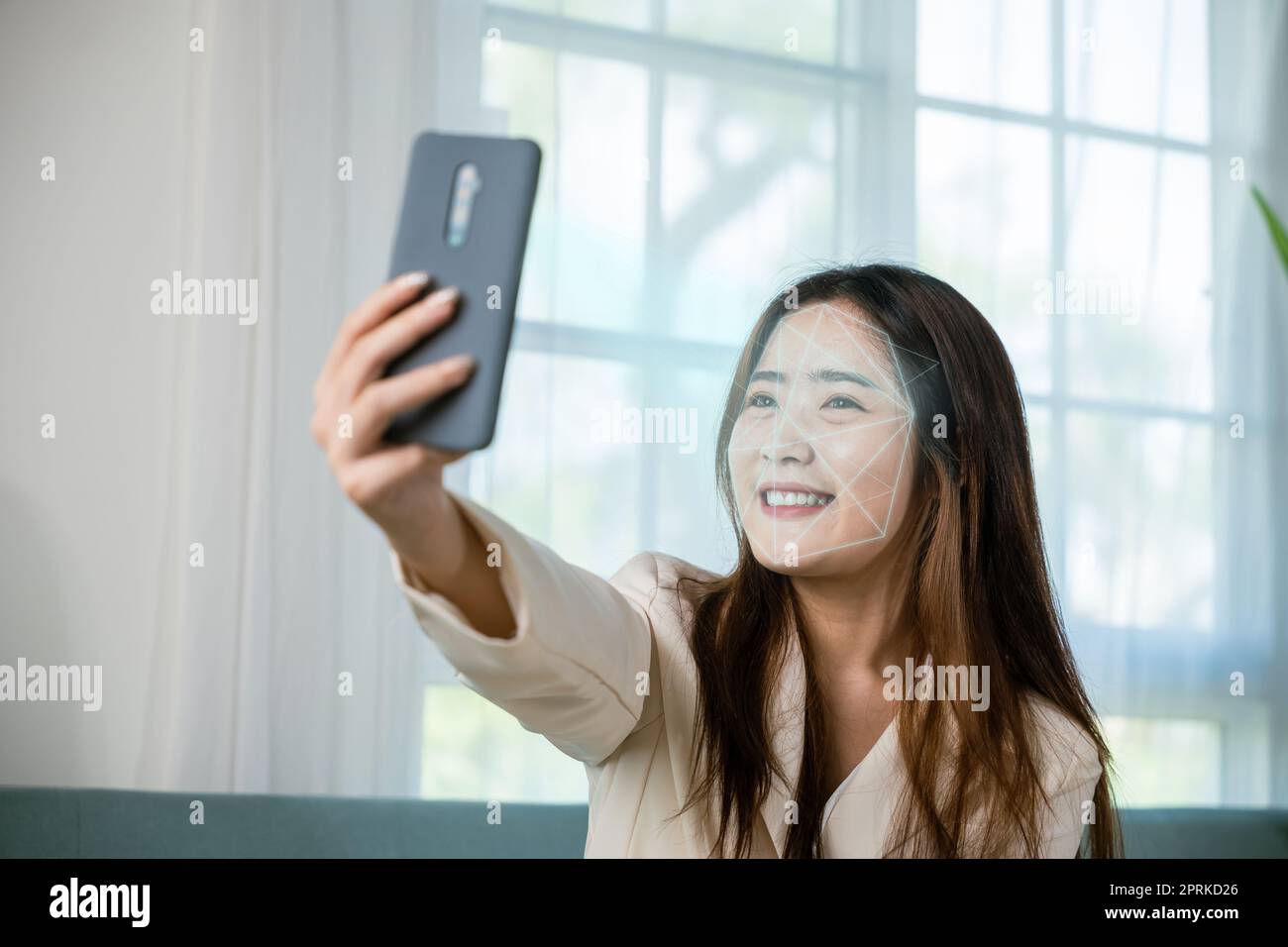 Asian women use smartphone for access control face recognition in ...