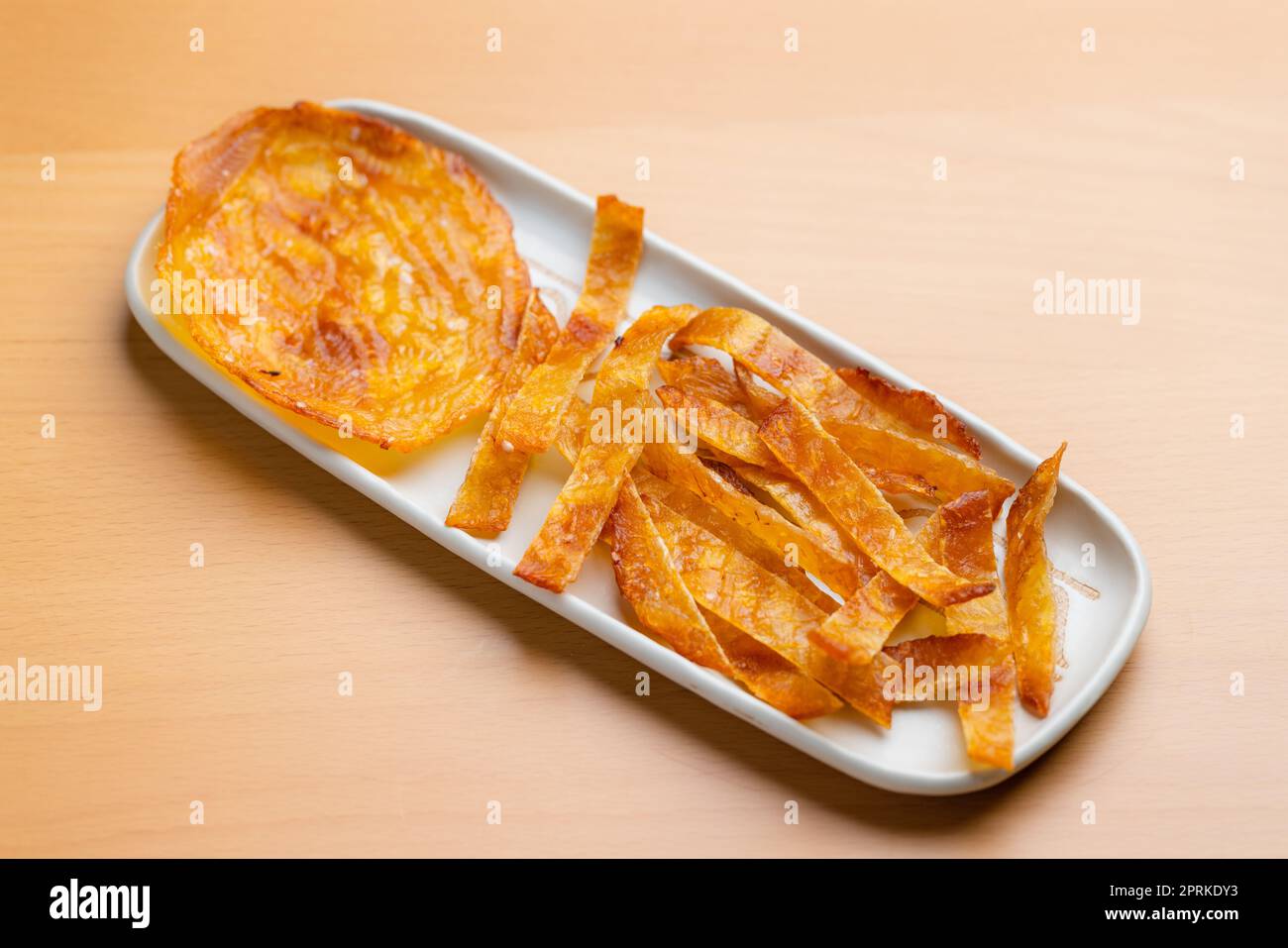 Cooked dried fish fillet snack Stock Photo - Alamy