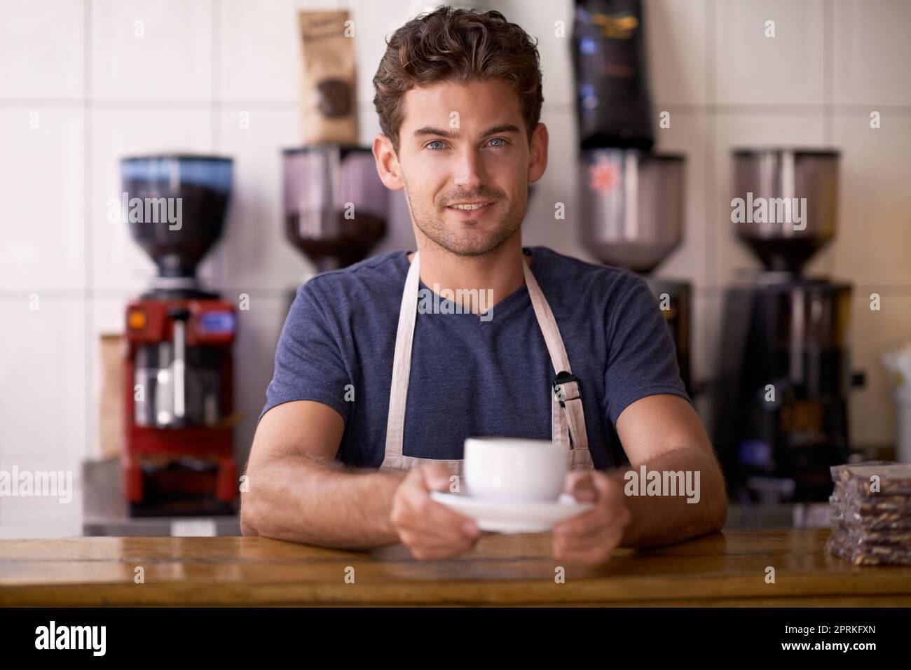 You name the blend and hell make it. Portrait of a young male barista ...
