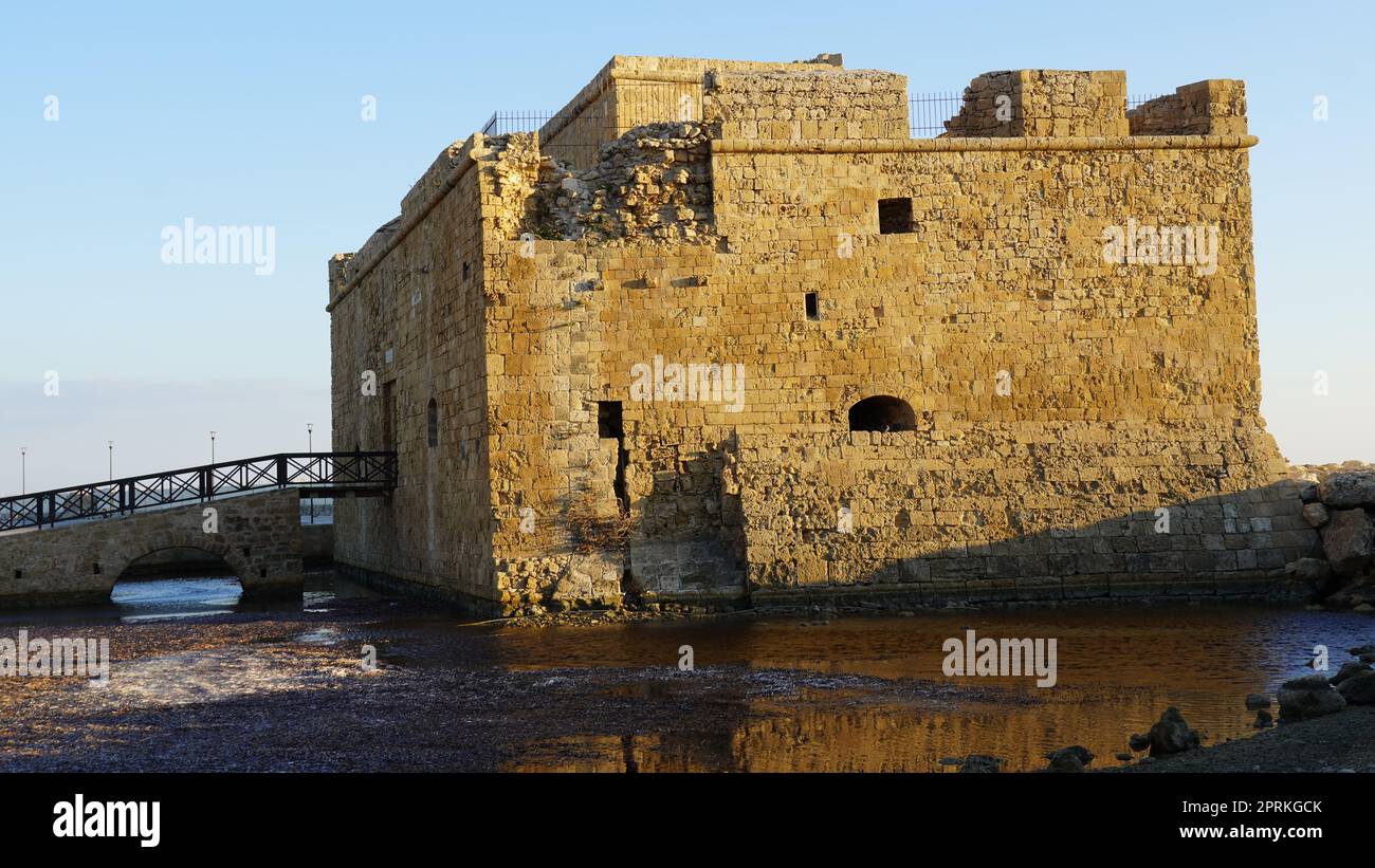 View of the Medieval castle at Paphos harbor in Cyprus. A famous travel ...