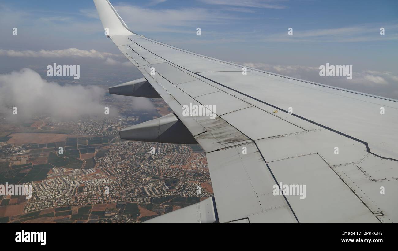 Wing of an airplane flying over Israel, Passenger s view. Looking ...