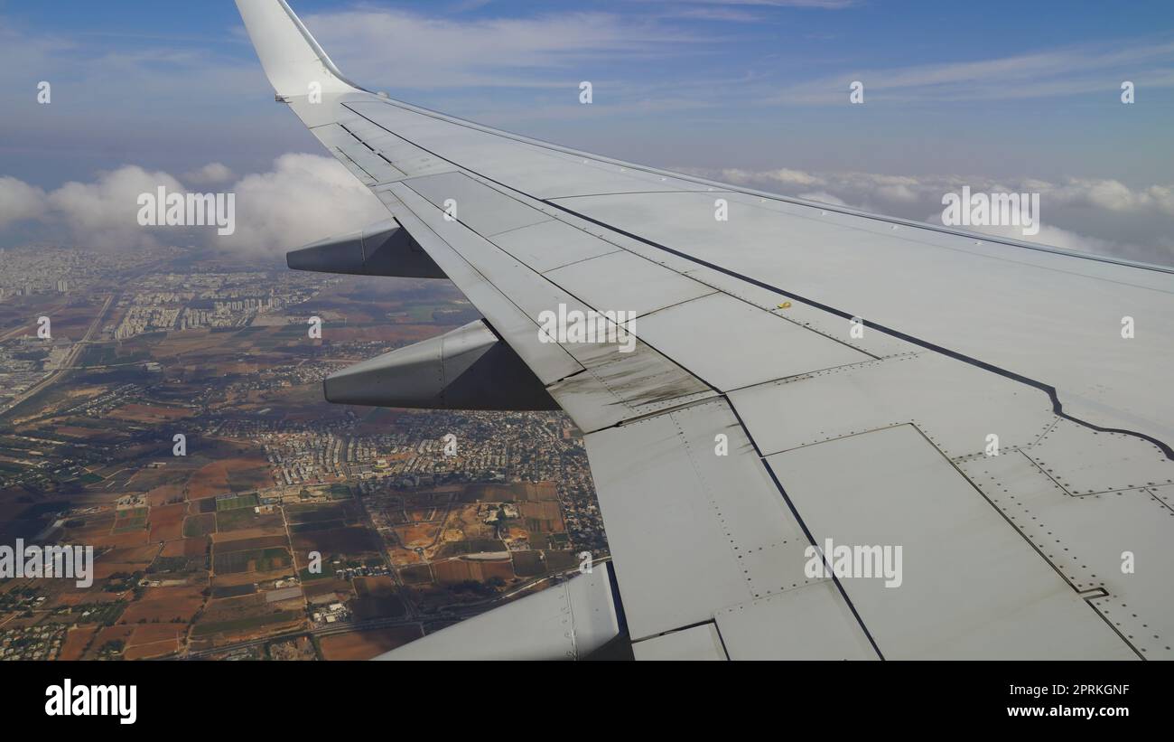 Wing of an airplane flying over Israel, Passenger s view. Looking ...