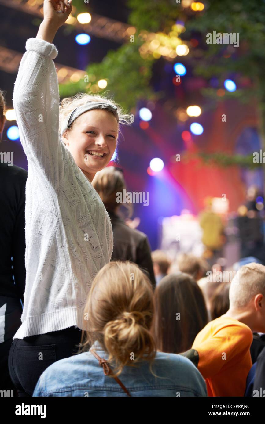 Excitement at the show. young people enjoying an outdoor music festival ...