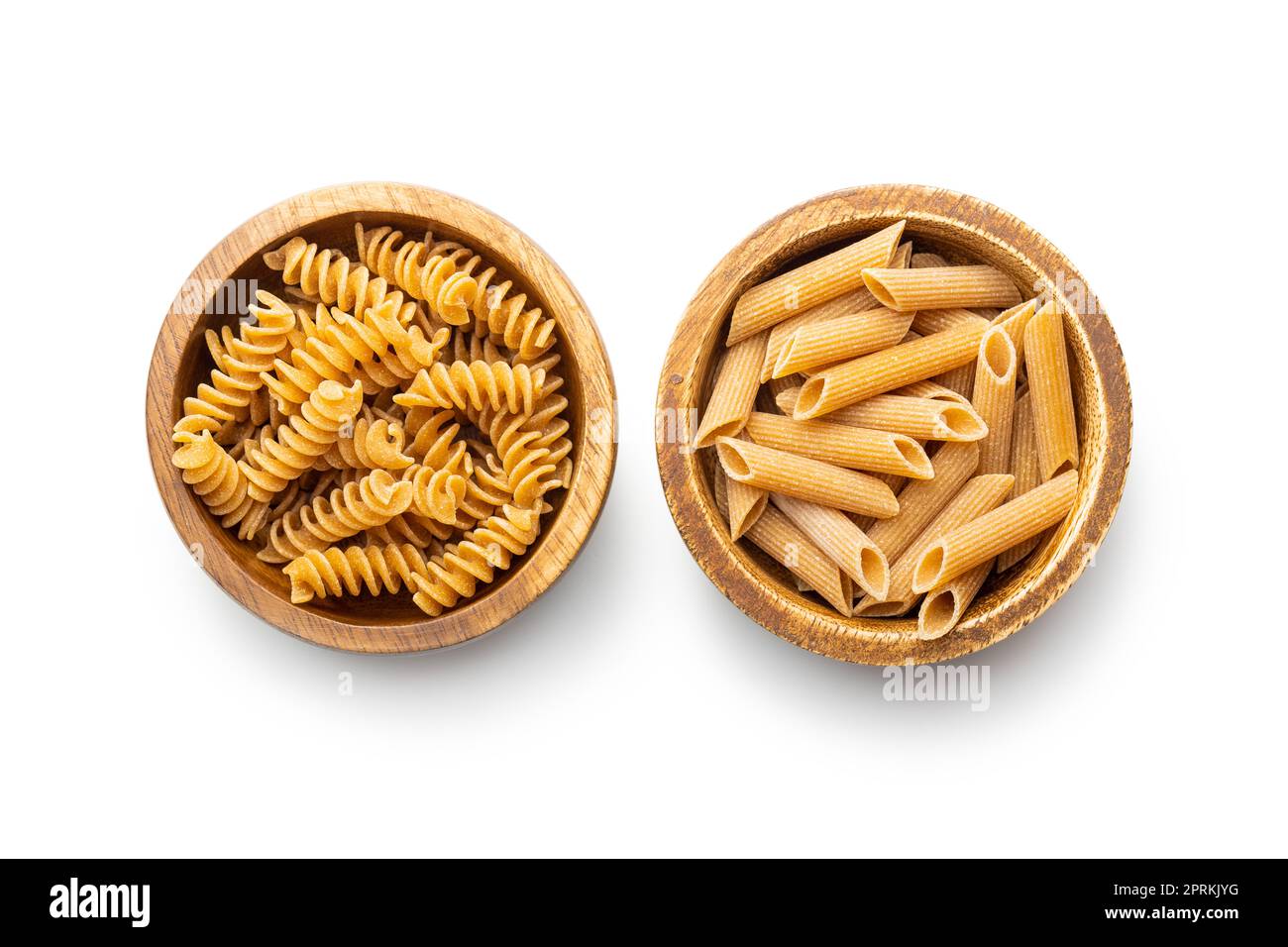 Uncooked whole grain pasta isolated on white background. Raw pasta in ...