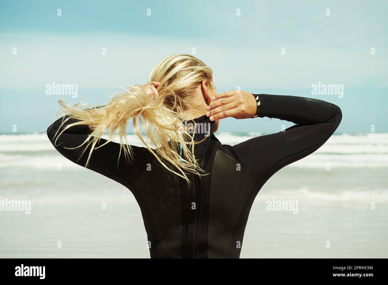 Tying back hair hi-res stock photography and images - Alamy