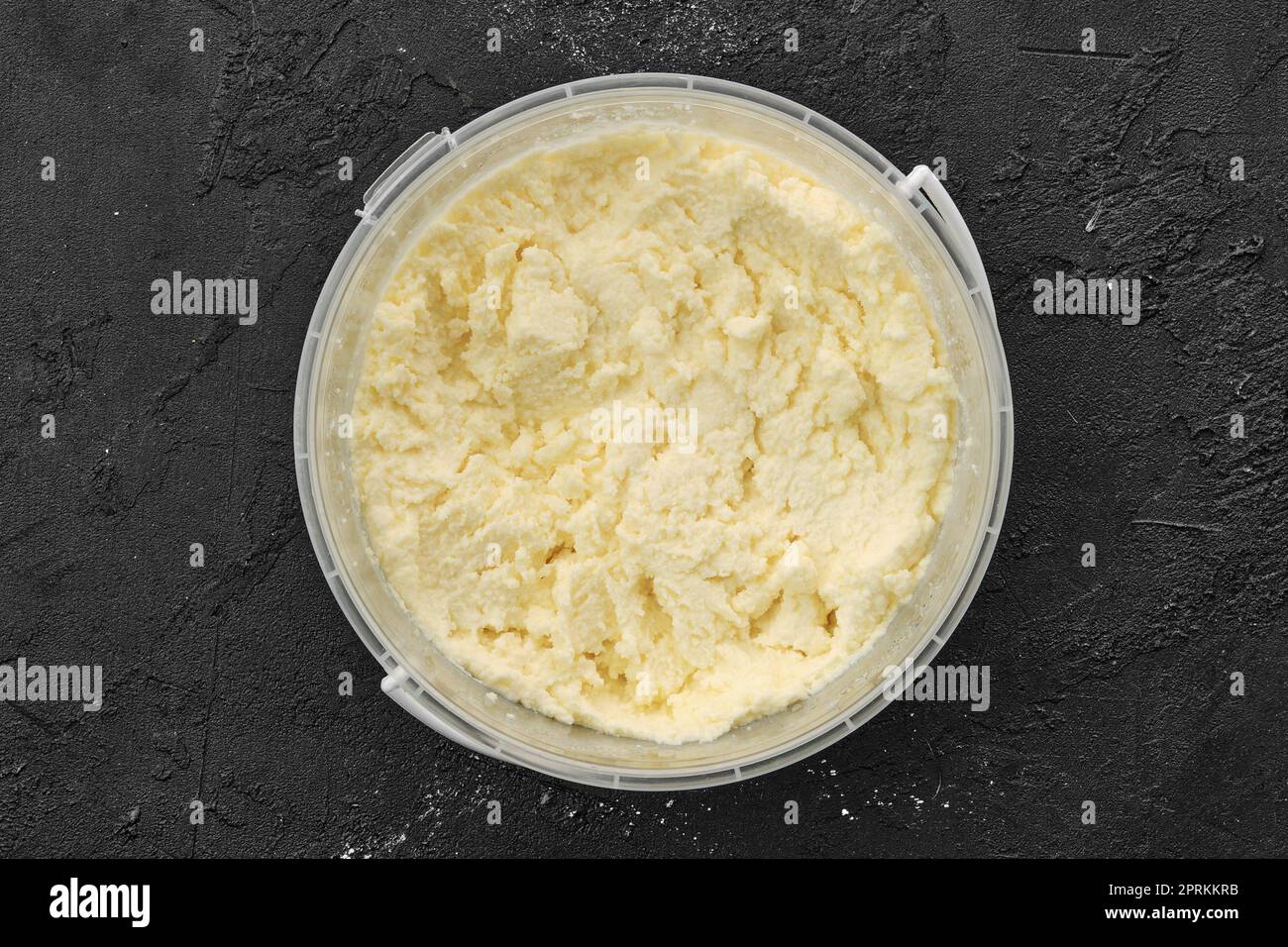 Top view of homemade processed cheese in plastic bowl Stock Photo - Alamy
