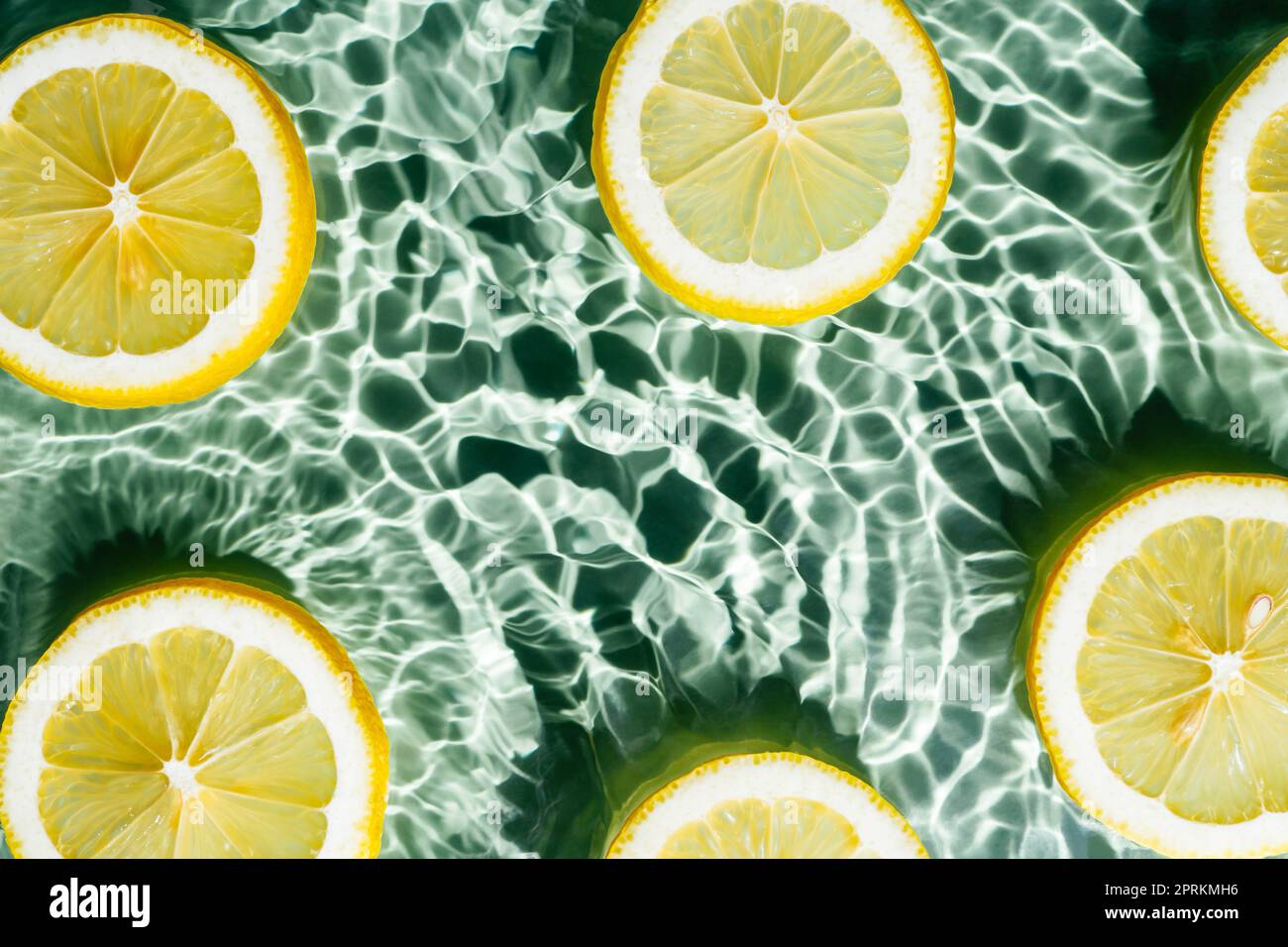 Transparent fresh exhilarant wave water with flecks background, lemon ...