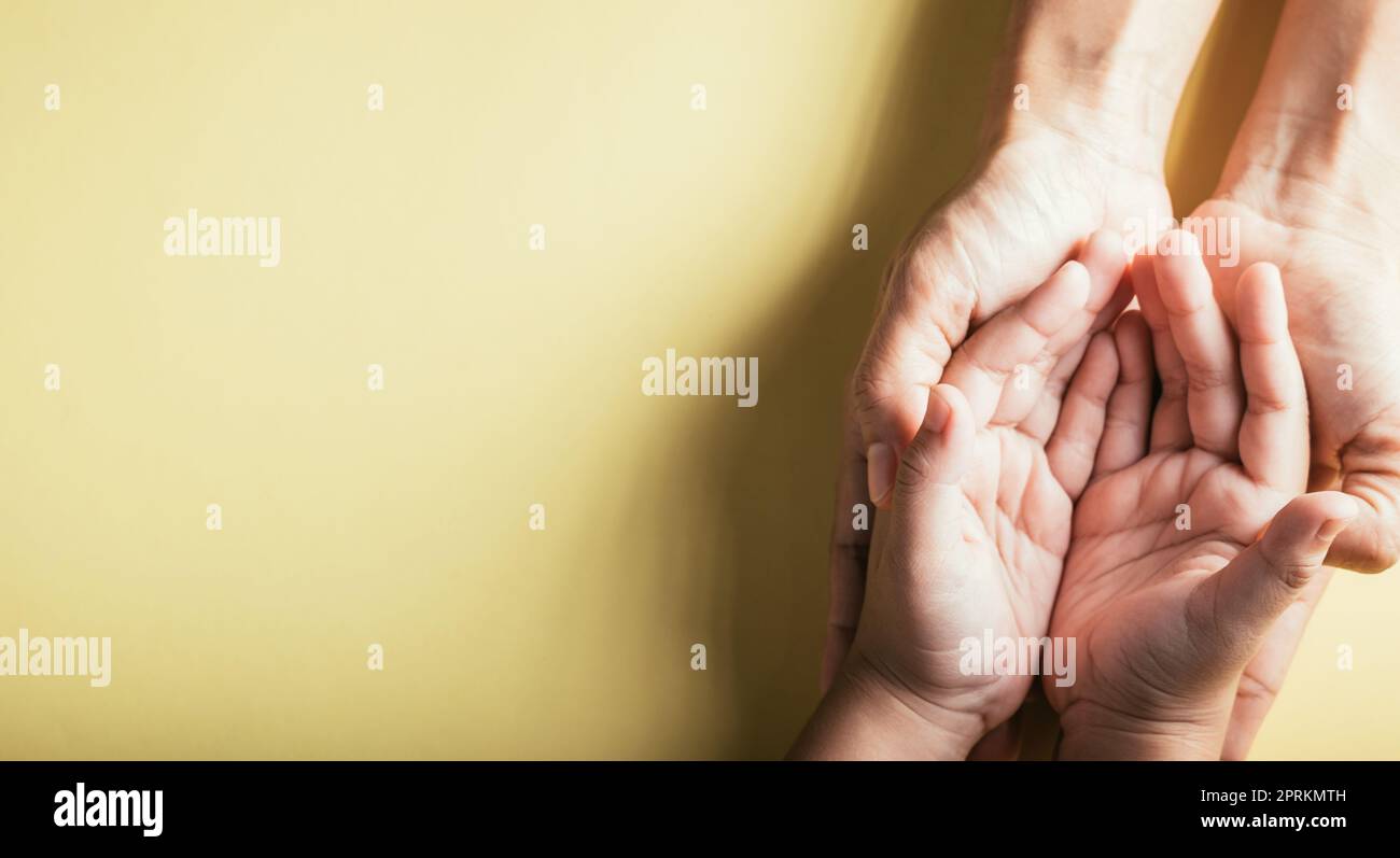 Close up hands children on adult mother hand, Top view person kid stack ...