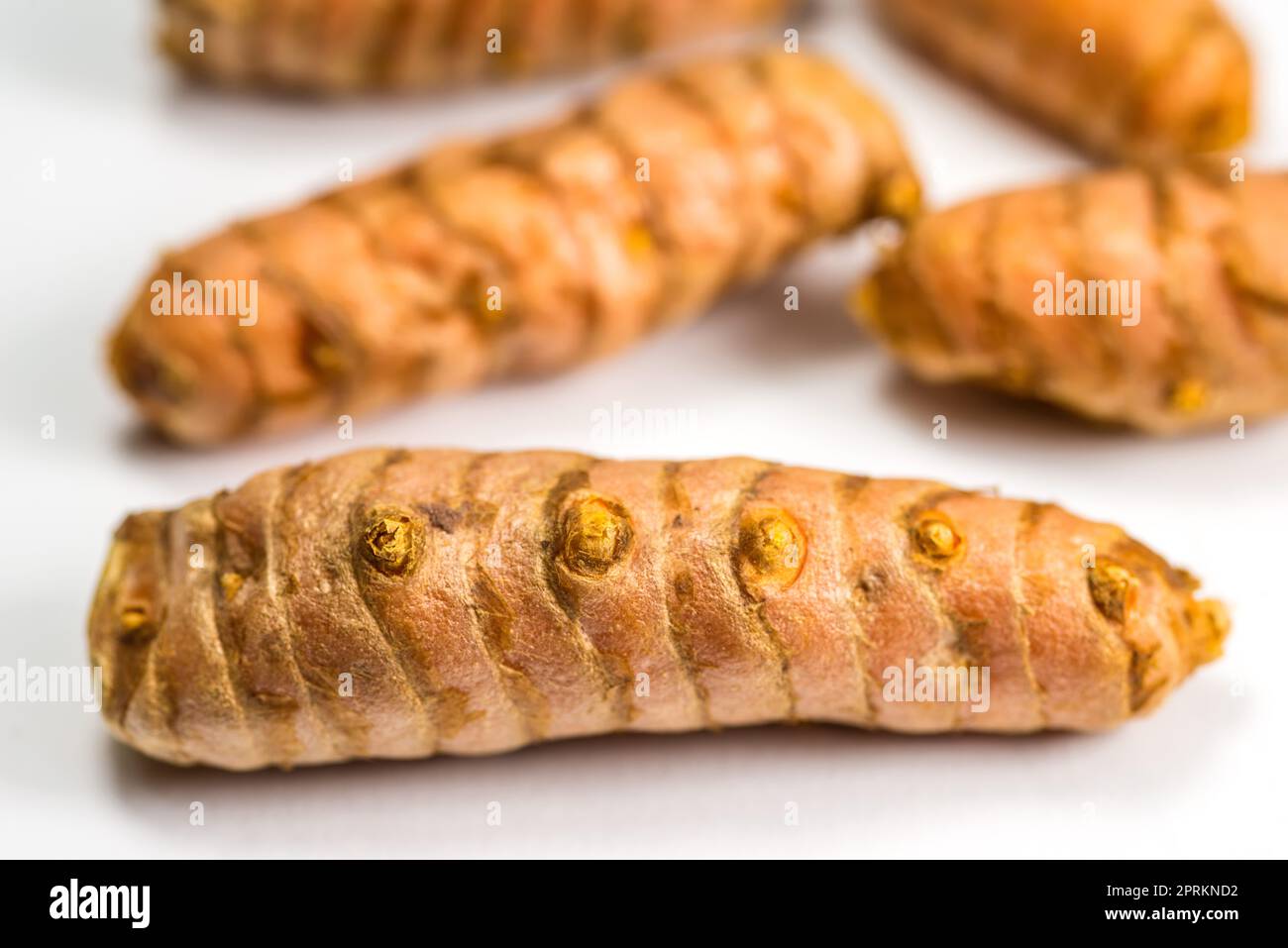 turmeric roots in a closeup Stock Photo - Alamy