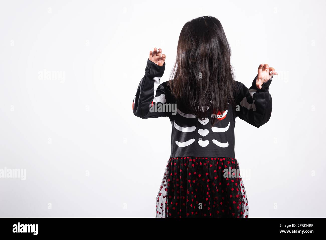 Asian little kid girl with face painting and hair covering face, woman ...