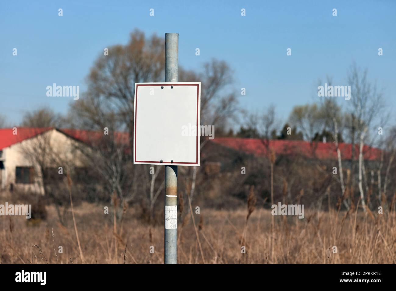Empty signboard on a piece of ground Stock Photo - Alamy
