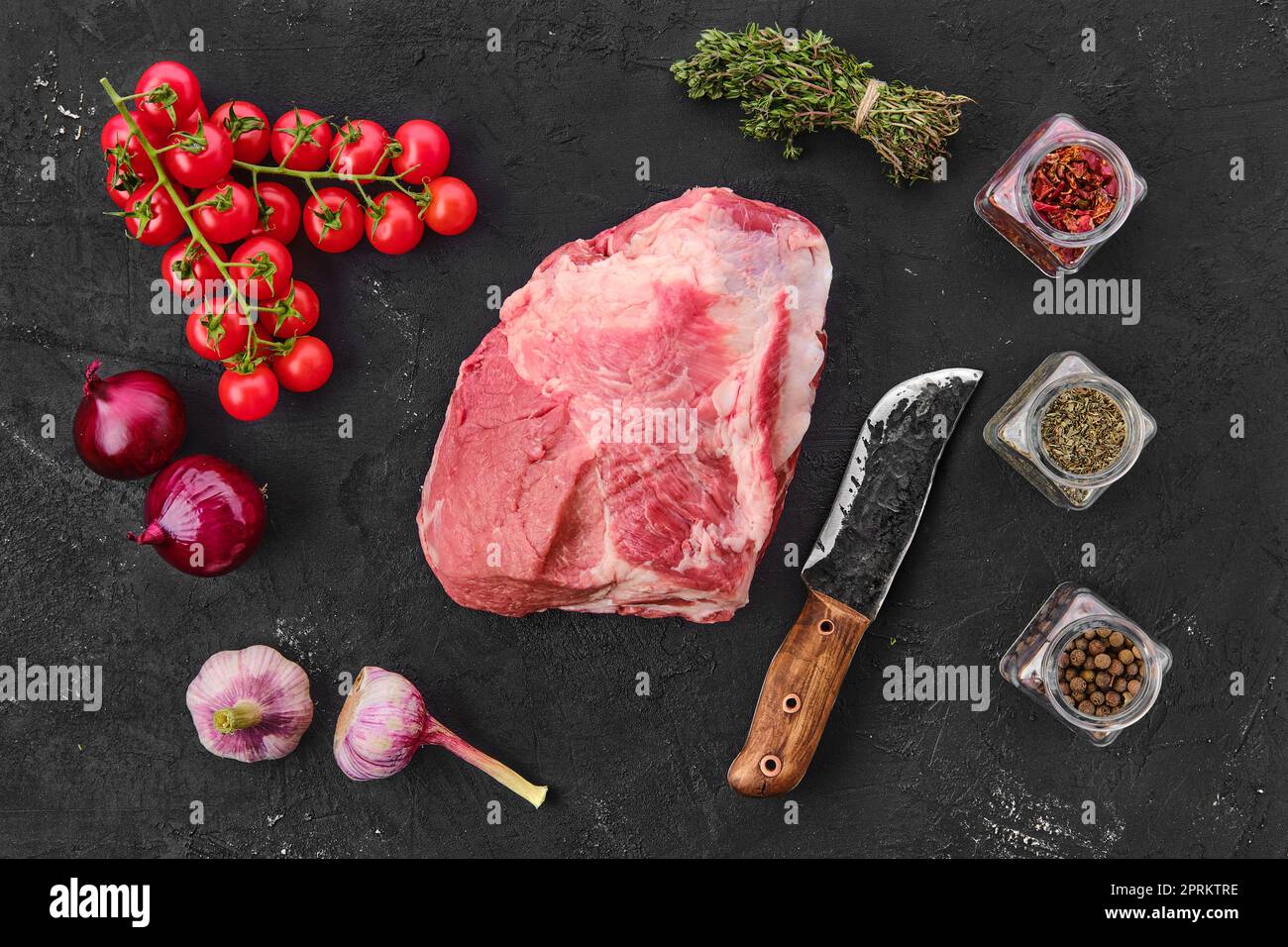 Raw fresh pork leg joint meat with spice on black background Stock ...