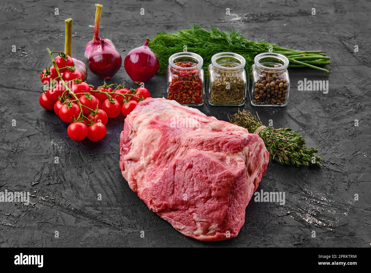 Raw fresh pork leg joint meat with spice on black background Stock ...