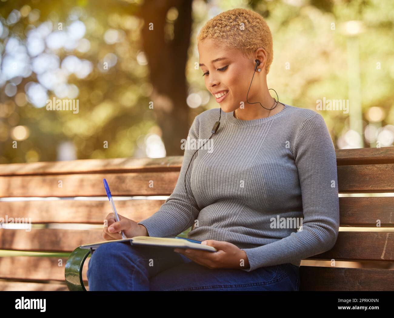Girl writing book outdoor hi-res stock photography and images - Alamy