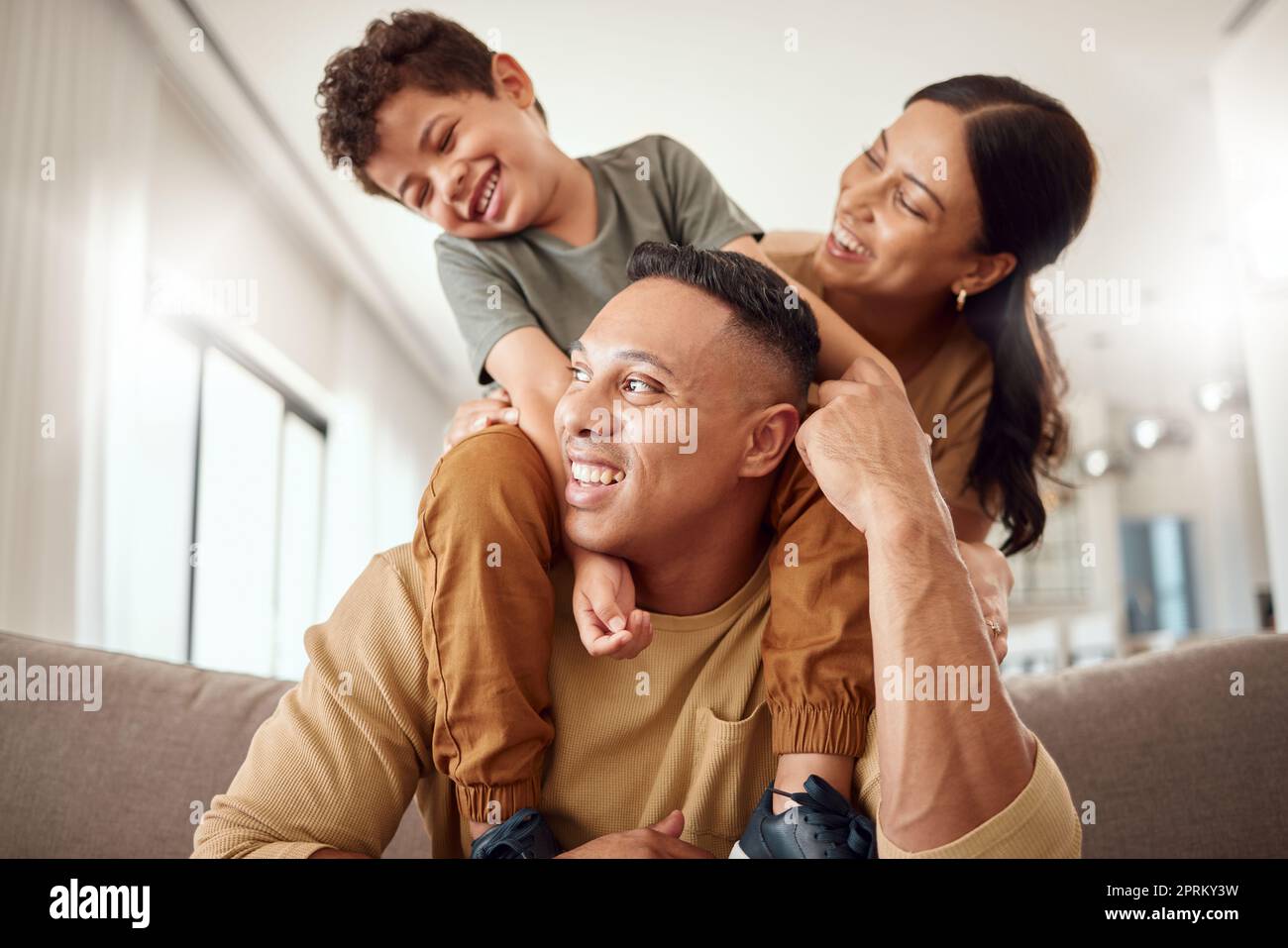 Family love, child and happy parents have fun bonding on sofa in family ...