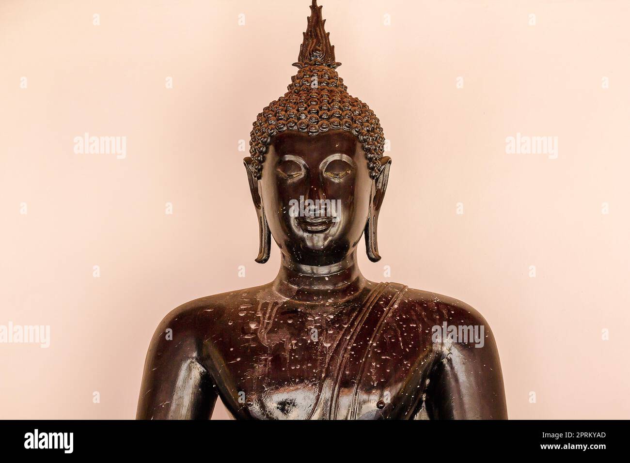 Black Buddha that is unique in carving Stock Photo - Alamy