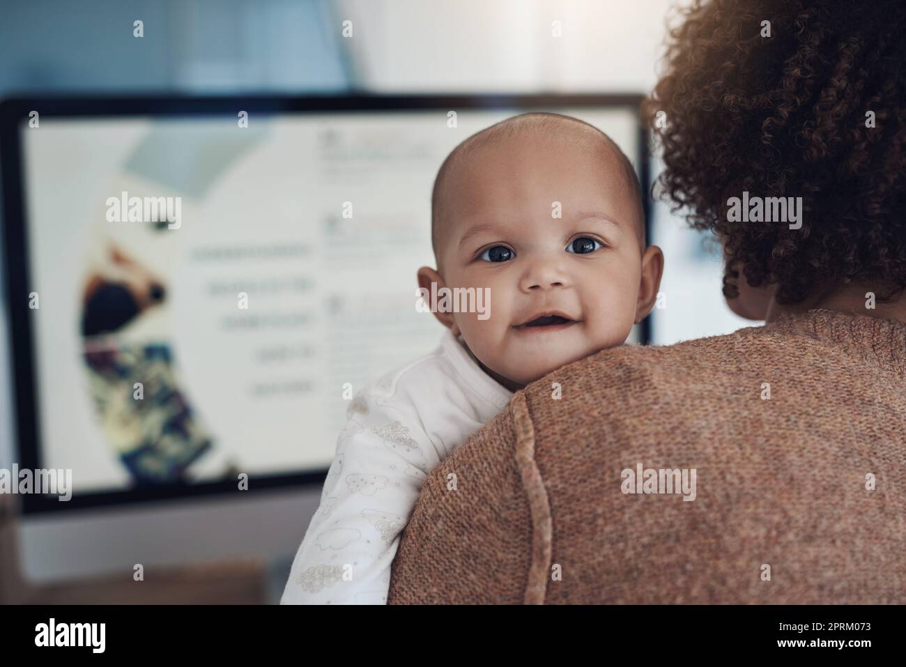 When I grow up I wanna be just like mom. a young woman using a computer ...
