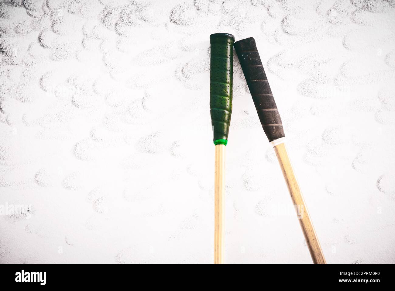 Let the ball squashing begin. two squash racquets leaning against the ...