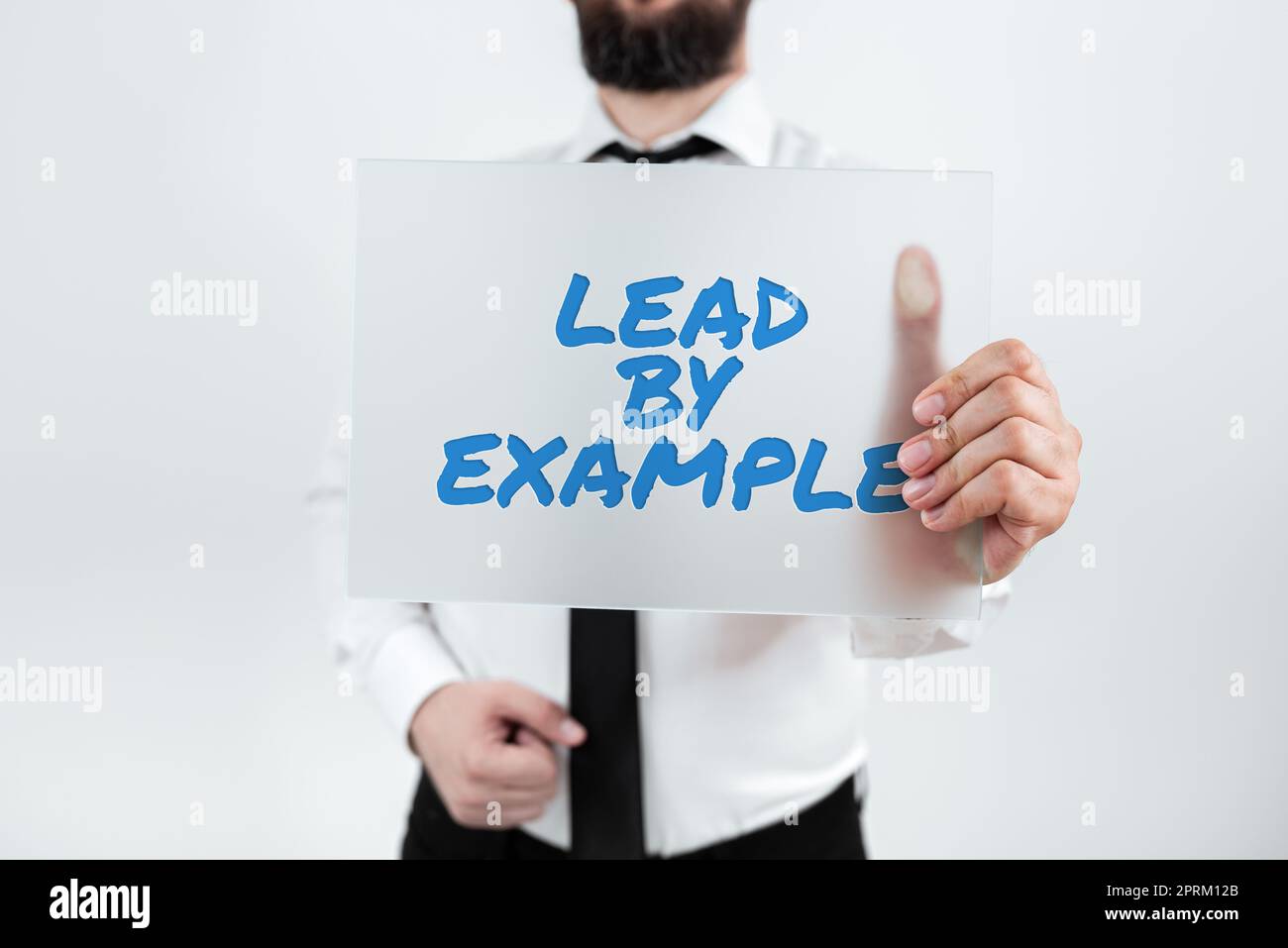 Hand writing sign Lead By Example, Conceptual photo Be a role model by ...