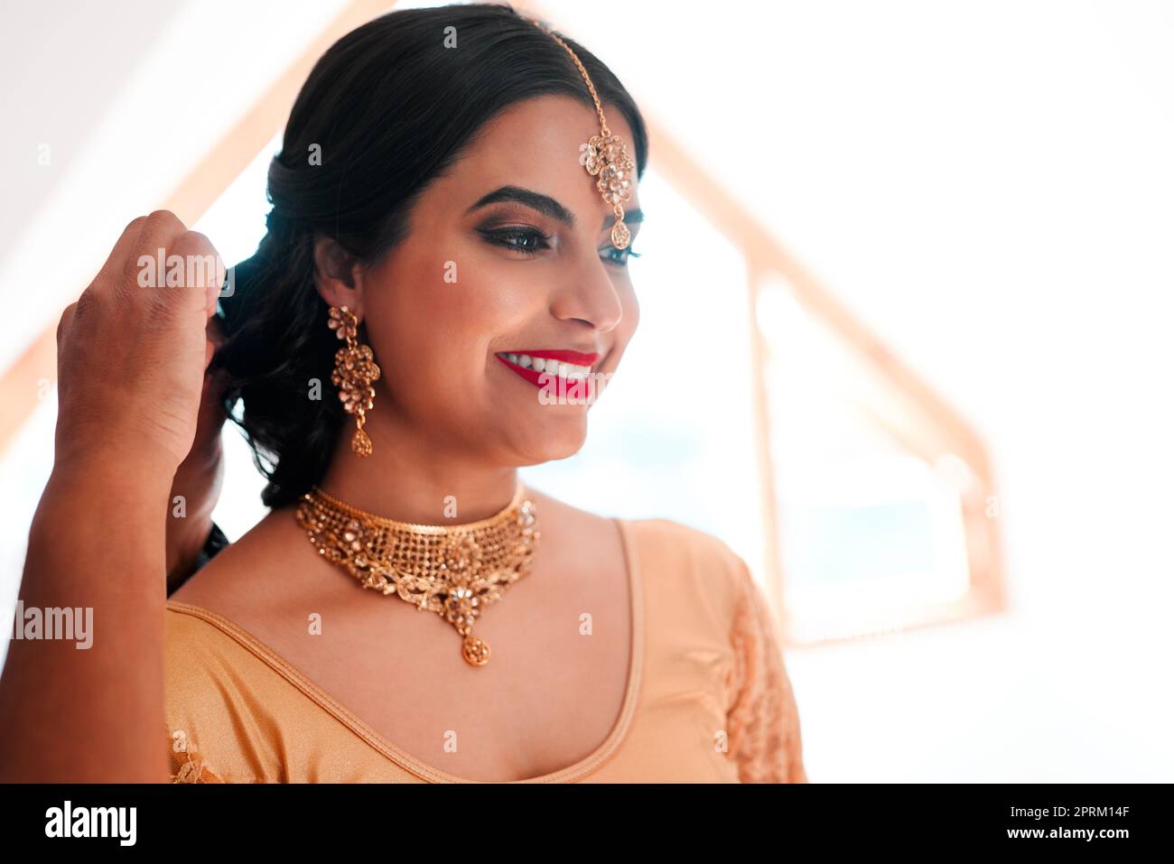 Bridal makeup done right. a beautiful young woman getting ready for her ...
