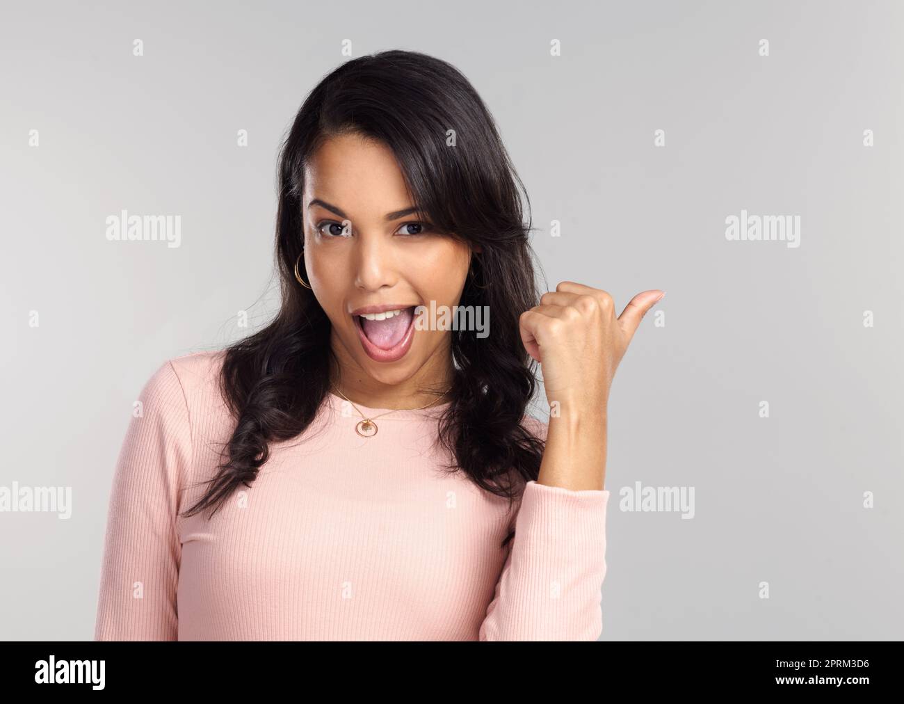 You know I got your back. a beautiful young woman pointing at copy ...