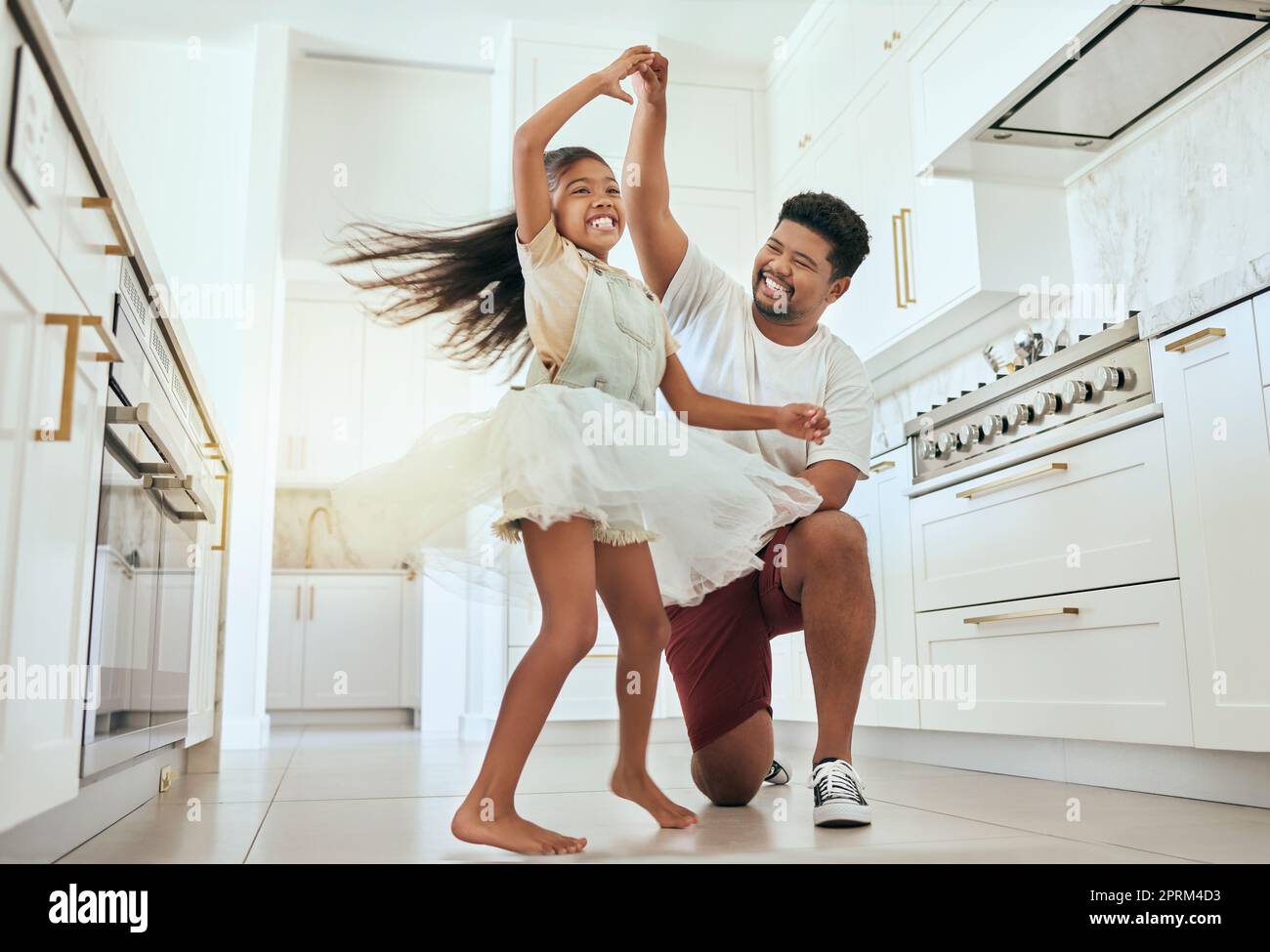 Love, dancing and father with girl in kitchen bonding, having fun and ...