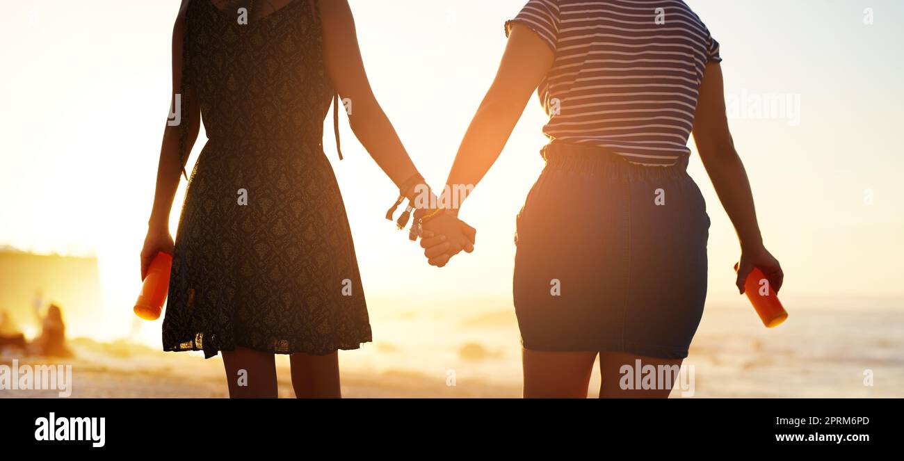 Two Best Friends Holding Hands In The Sunset