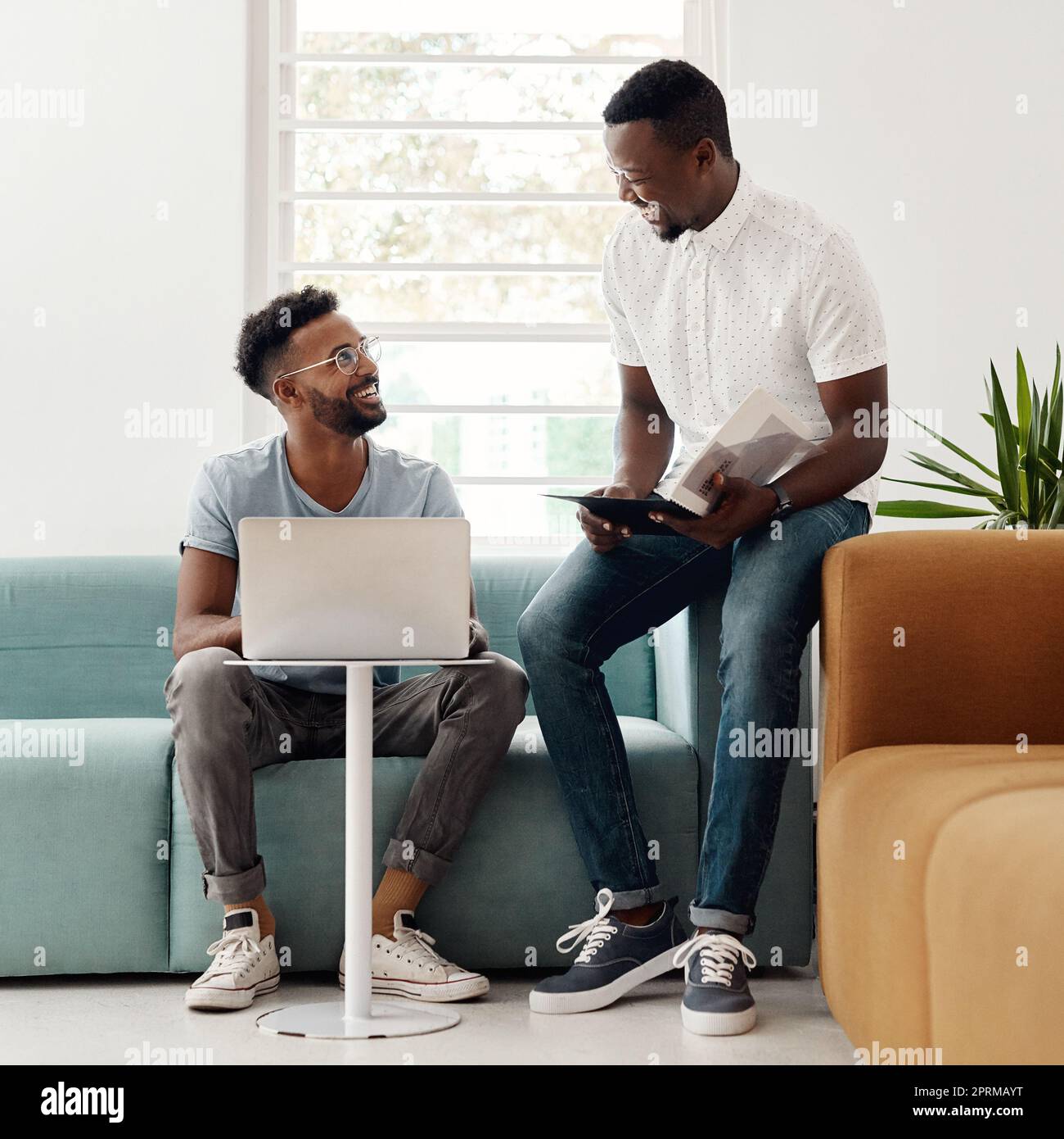 He is the office jokester. Full length shot of two handsome businessmen ...