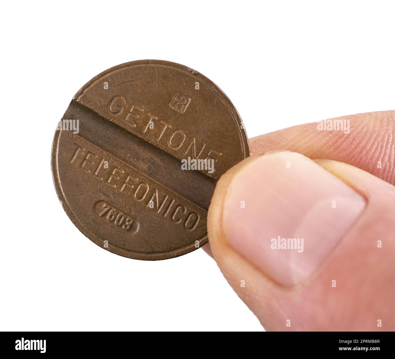 an old telephone token for Italian public telephones on a transparent ...