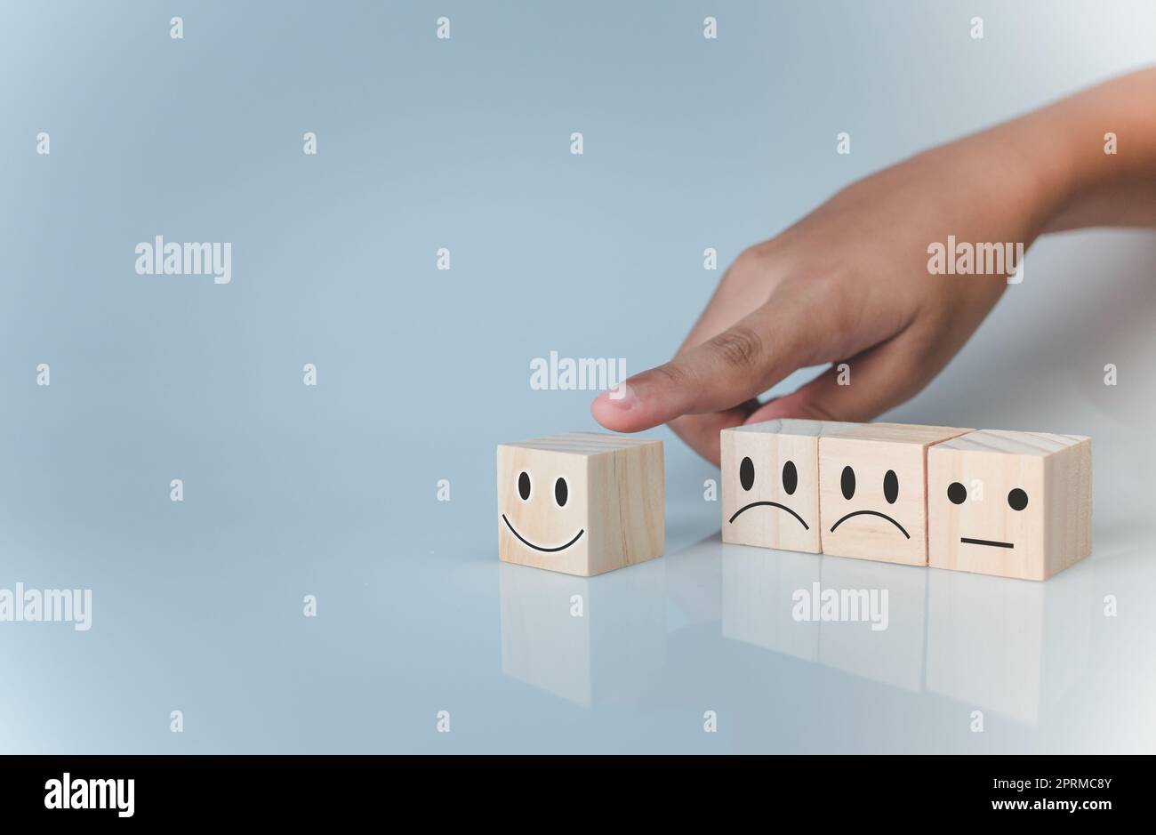 Hand choosing happy smile icon. represents feedback rating and positive ...