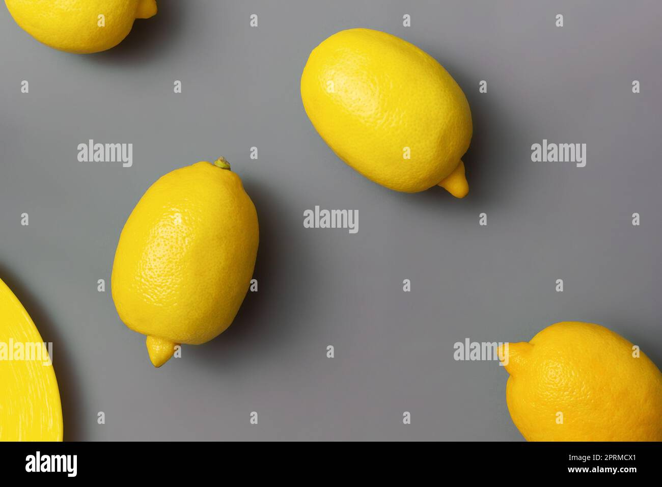 Yellow lemons on gray background. Colors of the Year 2021 Pantone ...