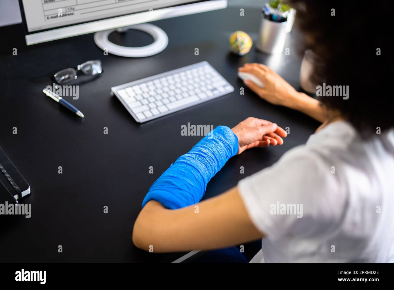 Injured Worker Compensation. Broken Arm African Woman On Computer Stock ...