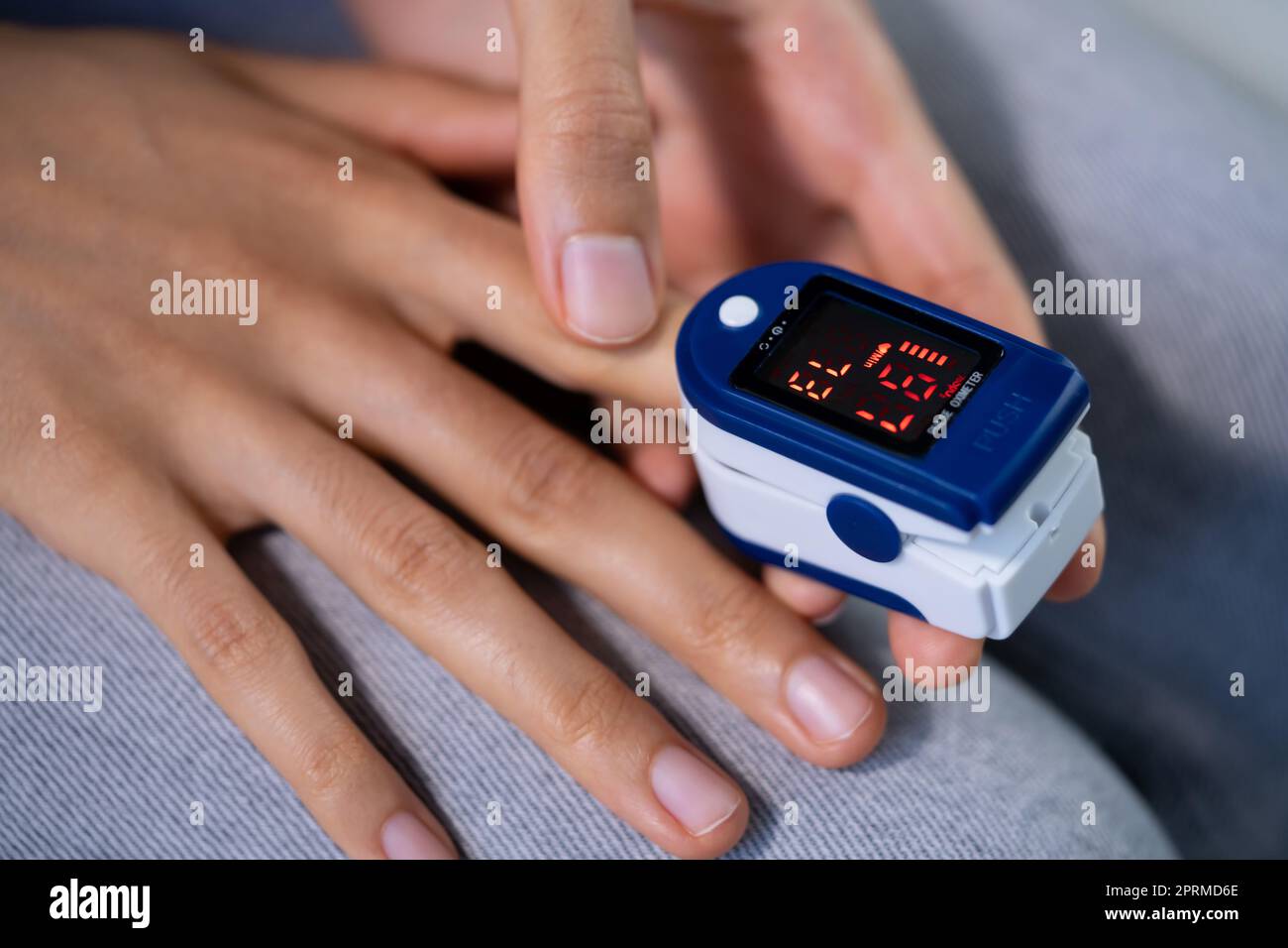 African Hand Pulse Heart Rate And Oximeter Stock Photo - Alamy