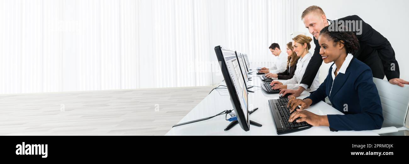 Happy Computer Training Staff People In Classroom Stock Photo - Alamy