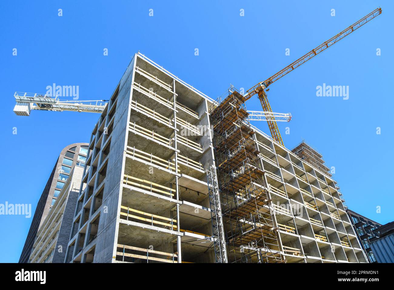 Large building construction site with cranes Stock Photo - Alamy
