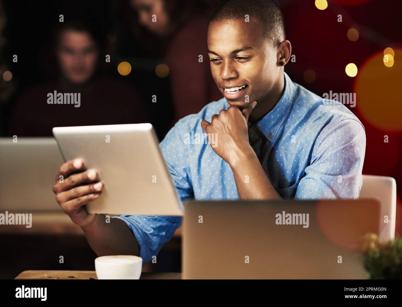 Young man working in office late night hi-res stock photography and ...
