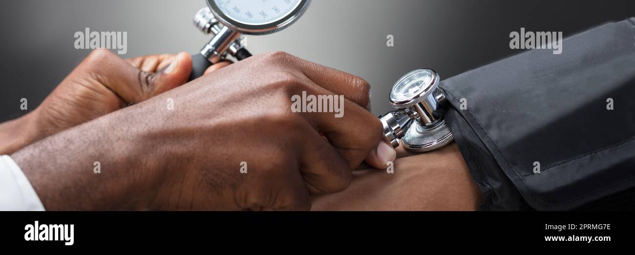 African American Measuring Blood Pressure And Hypertension Check Stock ...