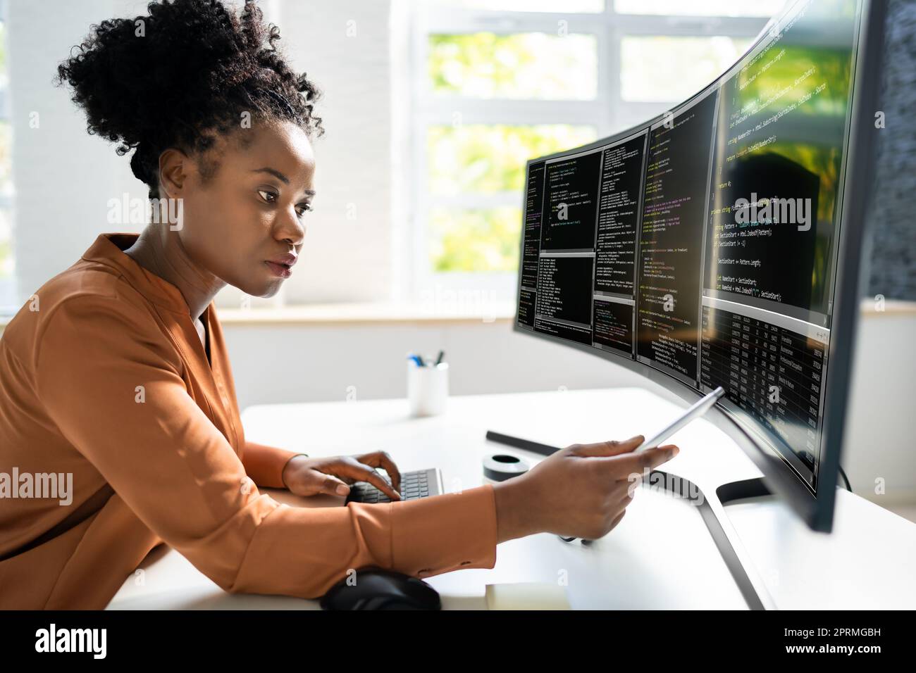 Computer Programmer Writing Program Code On Computer In Office Stock Photo - Alamy
