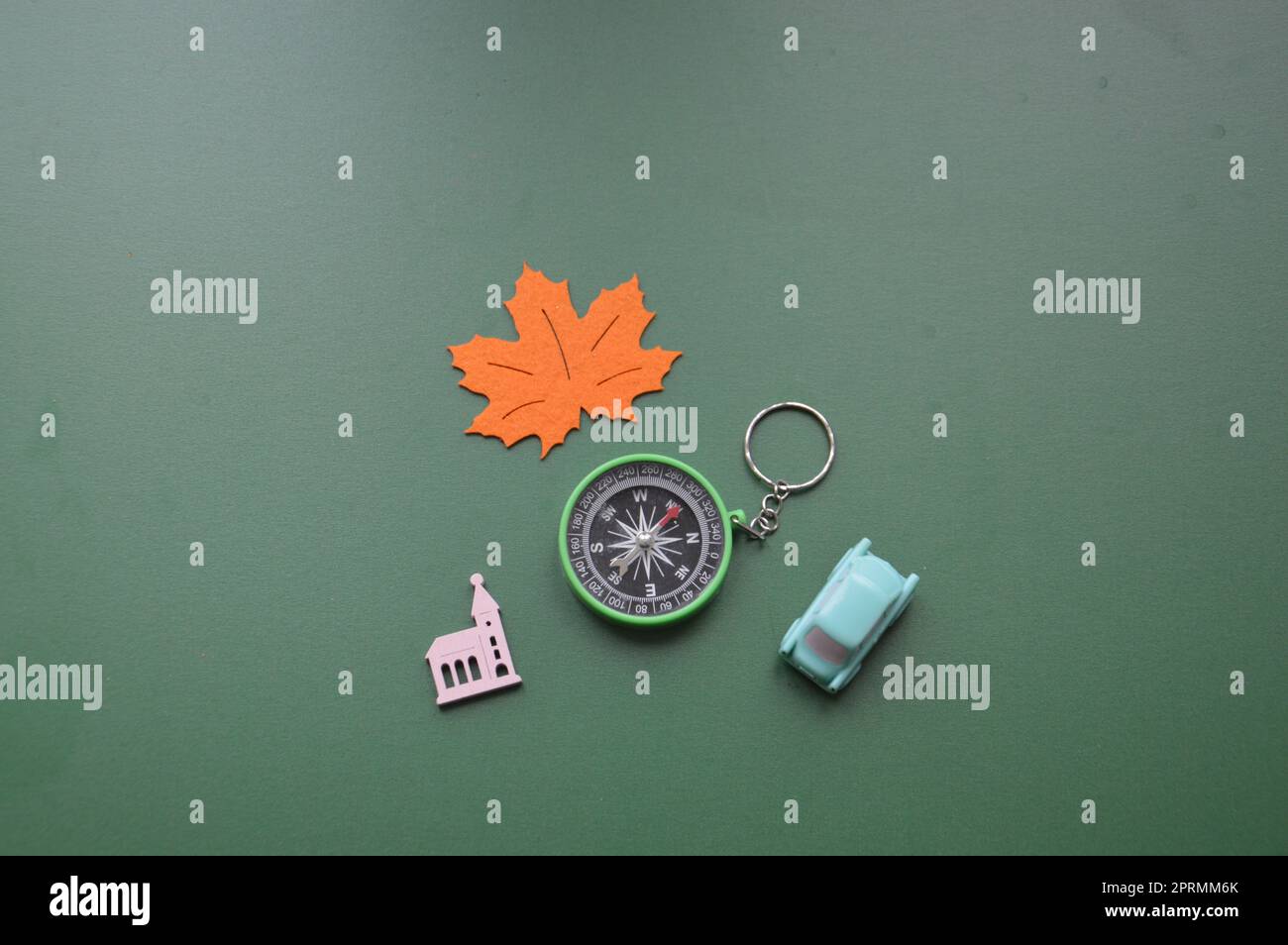 Hand compass for travel on the background of a objects Stock Photo - Alamy