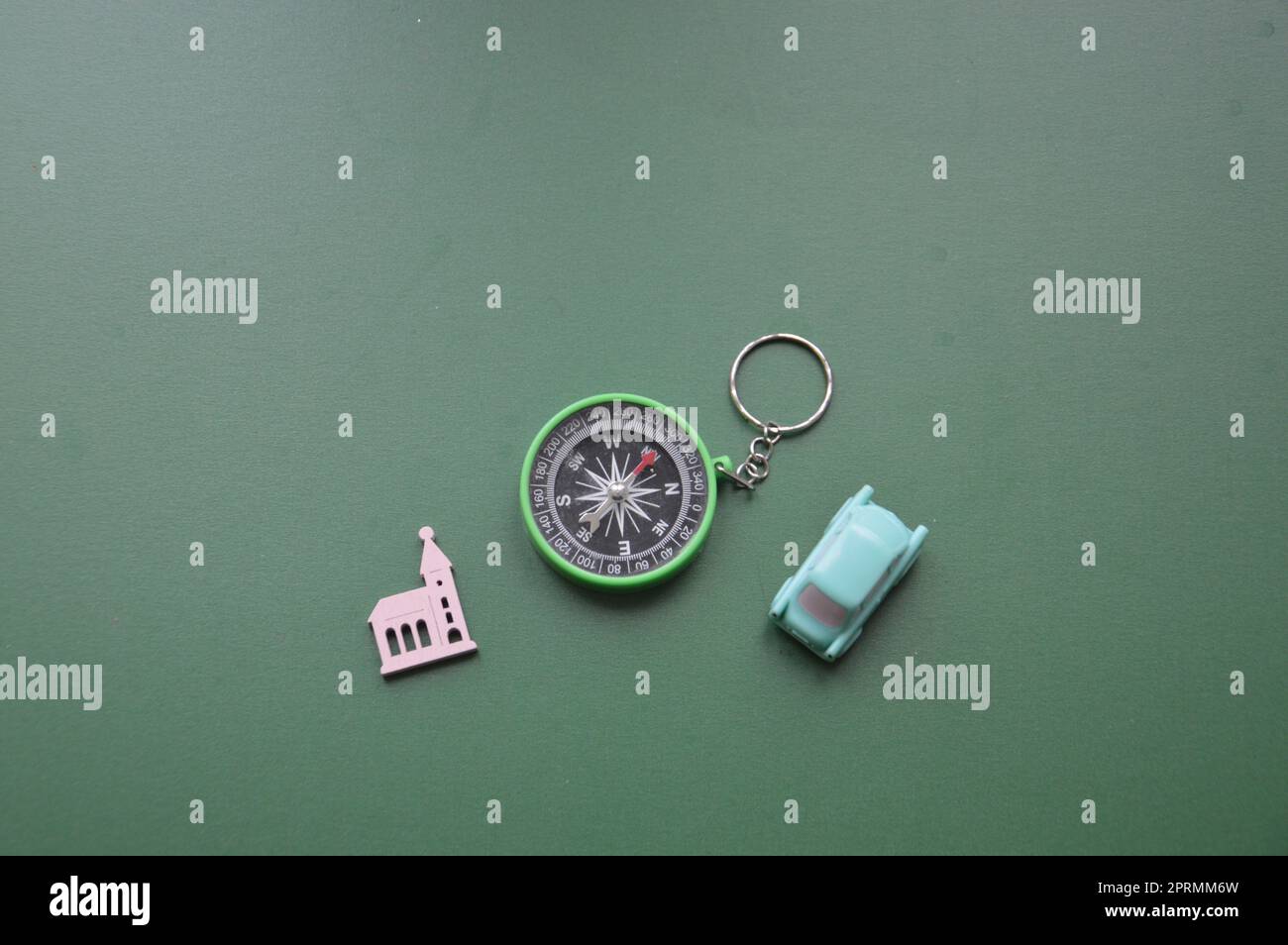 Hand compass for travel on the background of a objects Stock Photo - Alamy