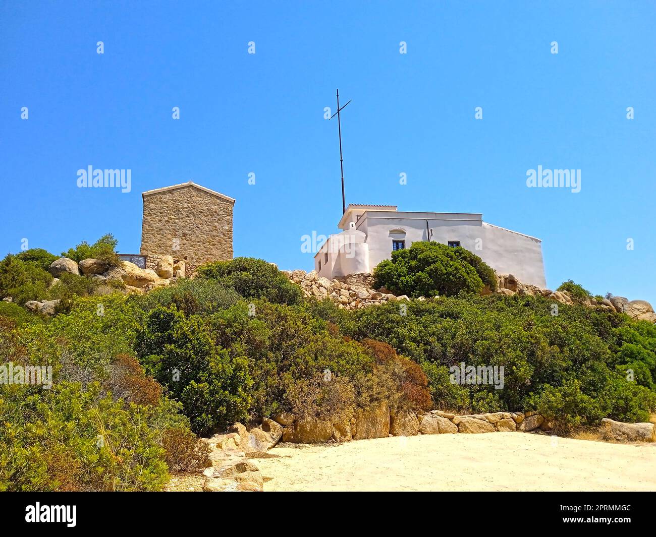 old lighthouse of Capo Comino Sardinia Stock Photo - Alamy