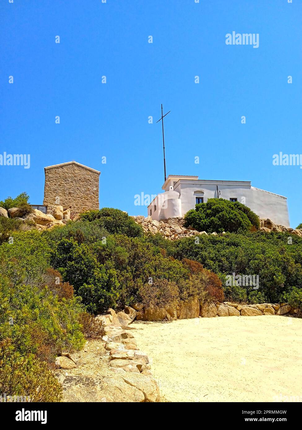 old lighthouse of Capo Comino Sardinia Stock Photo - Alamy