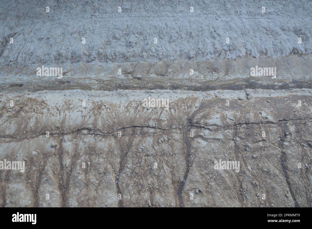 Patterns and textures of frozen ground in the winter Stock Photo - Alamy