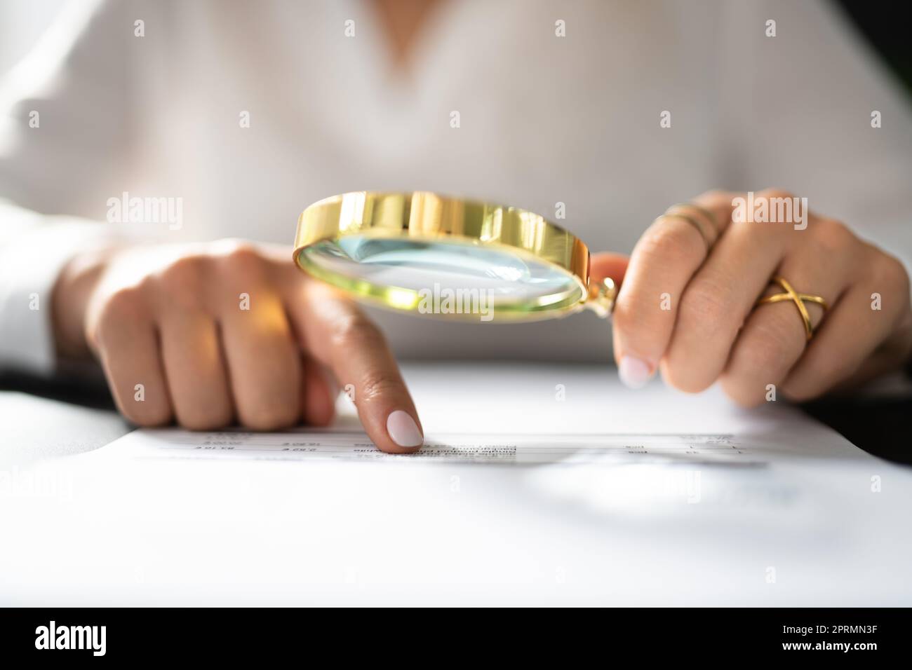 Auditor Using Magnifying Glass For Audit Stock Photo - Alamy