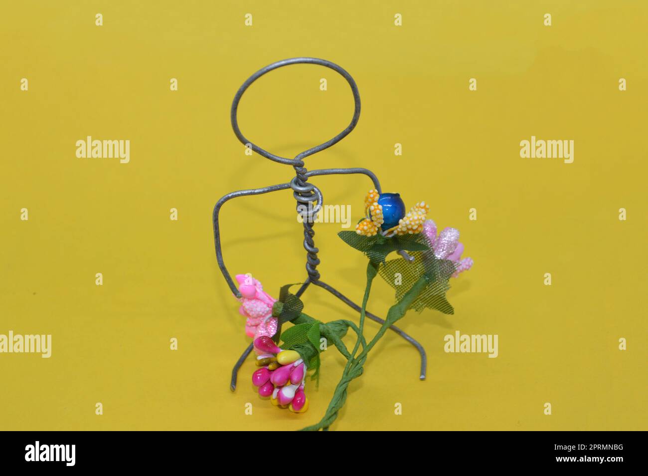 Human figure made of metal wire with an the object Stock Photo - Alamy